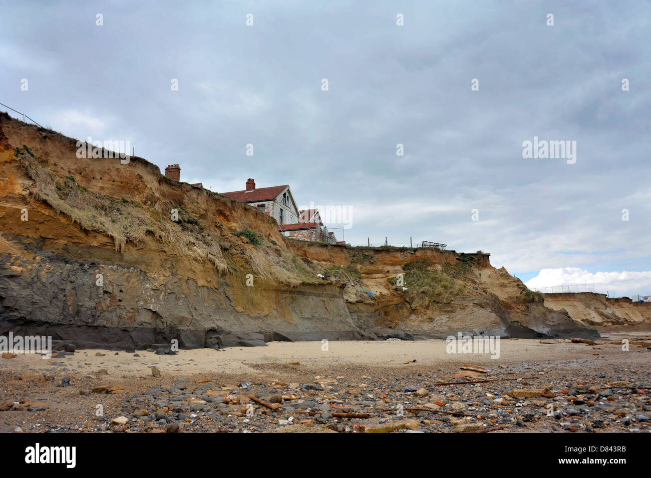 Progress of coastal erosion in Happisburgh, Norfolk which leaves homes closer to the cliff edge ...