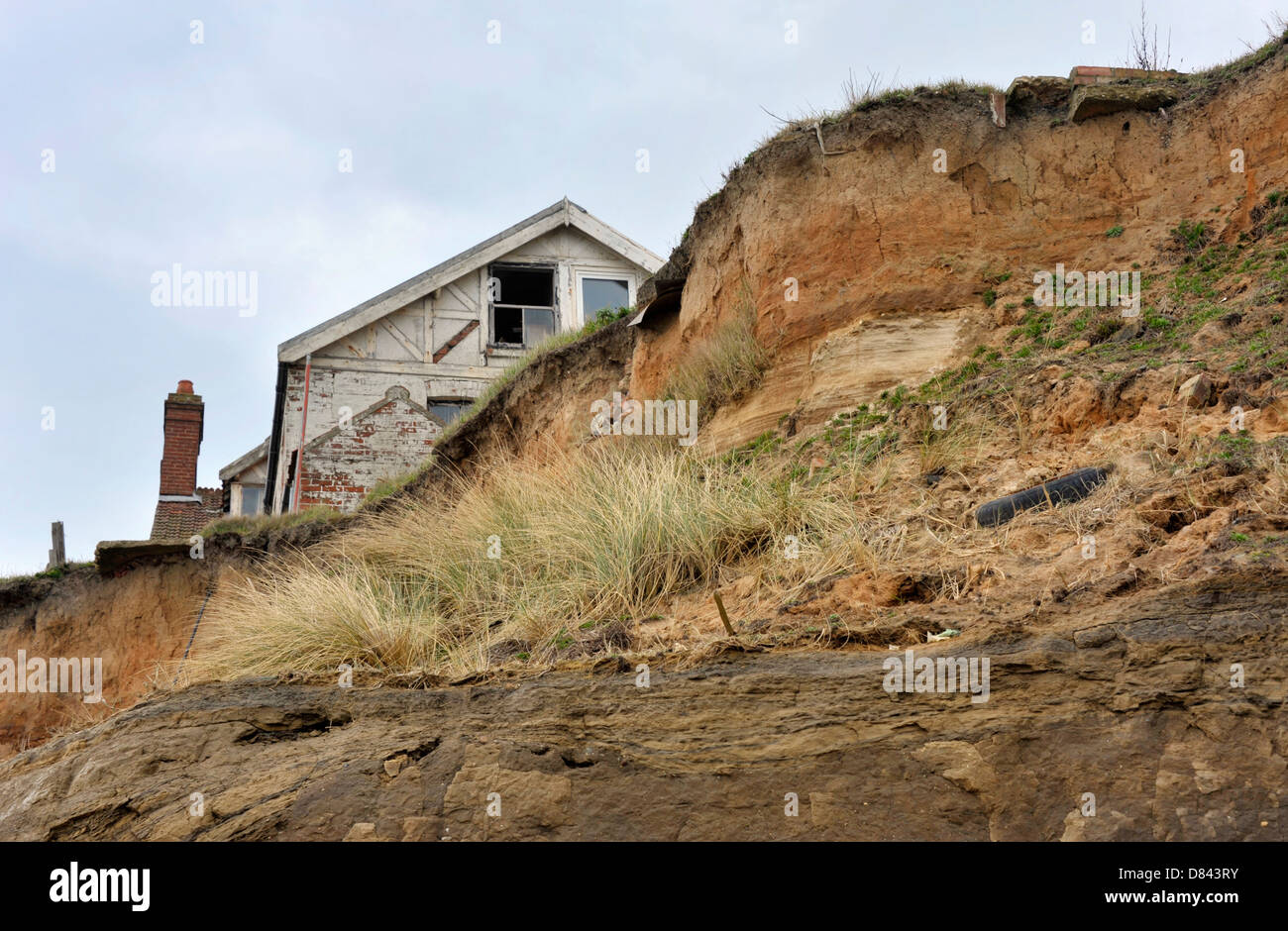 Homes on the cliff edge at Happisburgh in Norfolk demonstrating levels ...