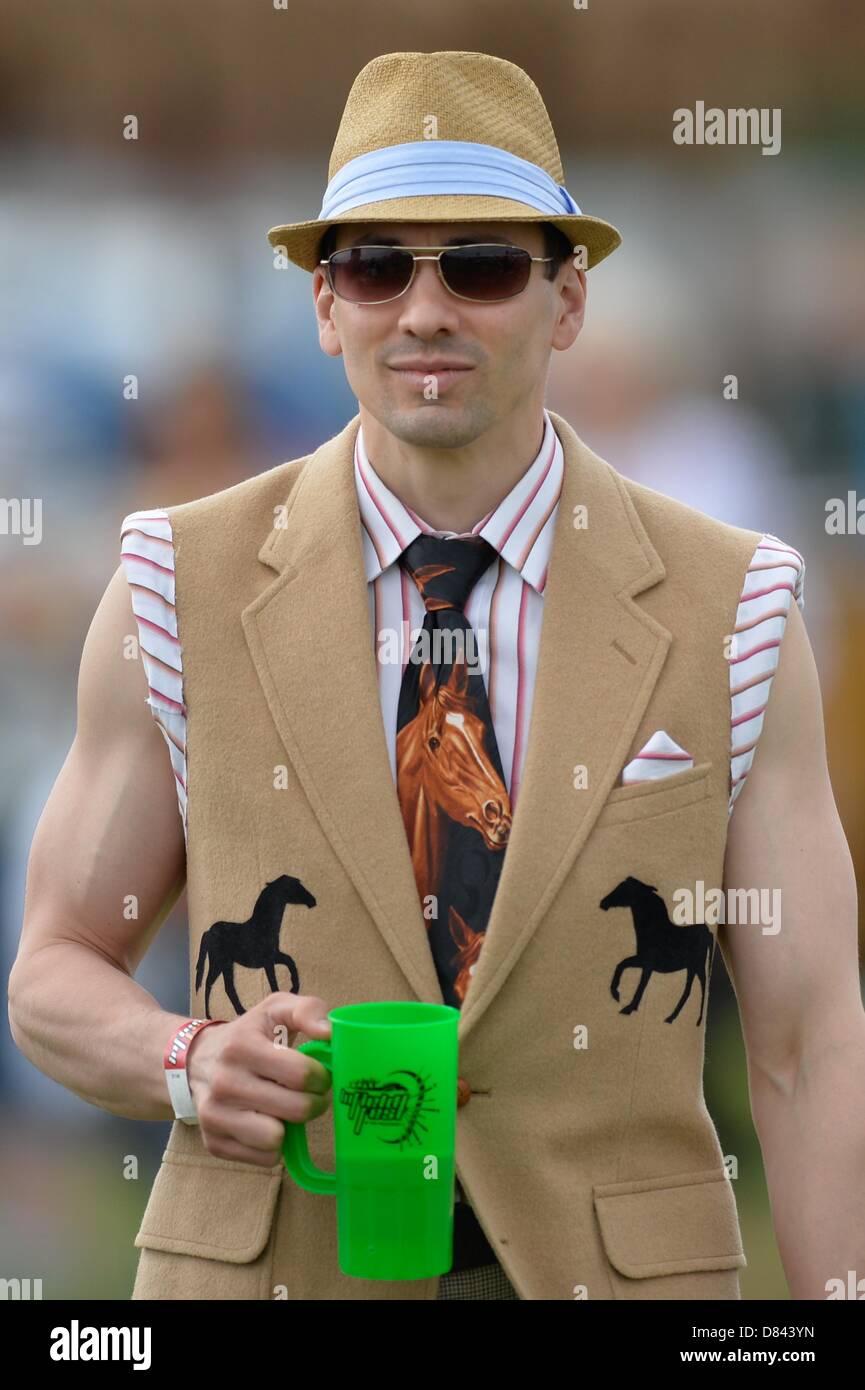 Baltimore, USA. 18th May, 2013. A racing fan cruises the infield during ...