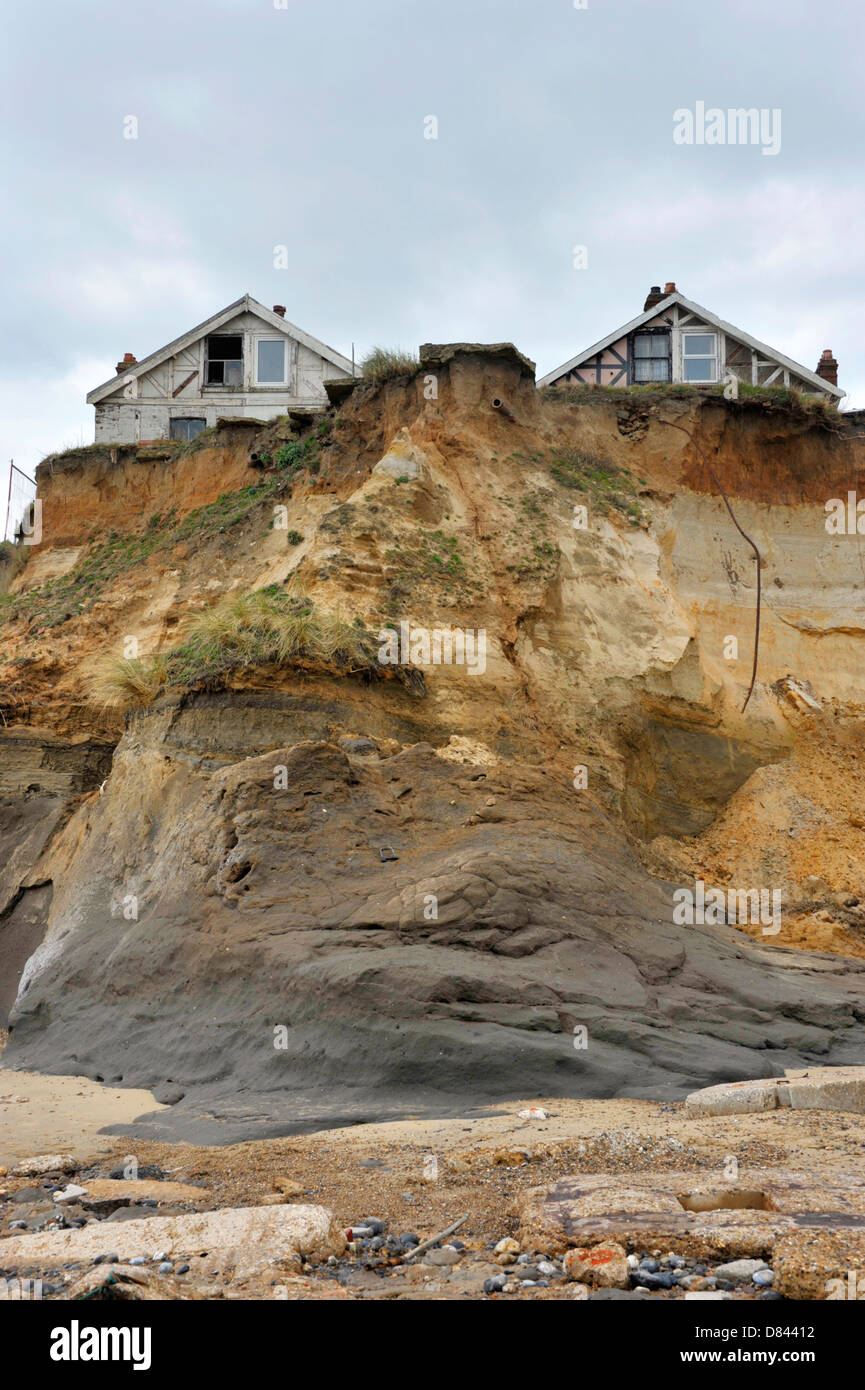 Homes on the cliff edge at Happisburgh in Norfolk demonstrating levels ...