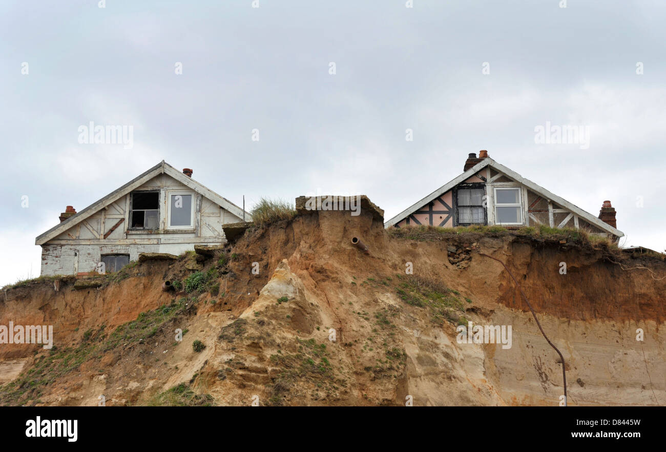 Homes on the cliff edge at Happisburgh in Norfolk demonstrating levels ...