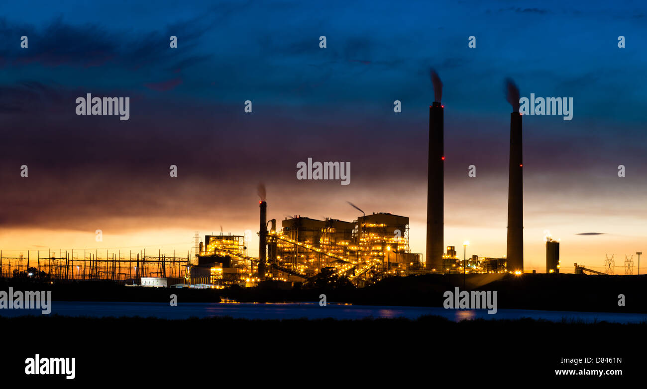A coal power plant lit up at night Stock Photo - Alamy