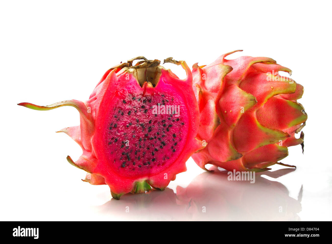 vivid and vibrant red dragon fruit isolated on white Stock Photo - Alamy