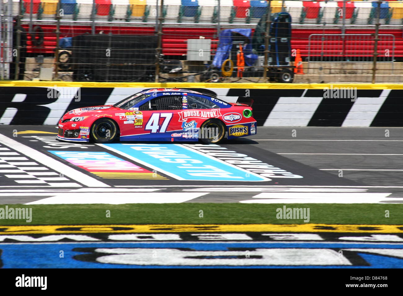Charlotte, USA. 17th May, 2013. Bobby LaBonte passes the grandstand ...