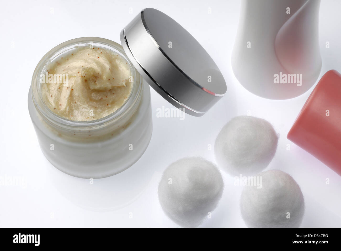 body scrub in packaging with cotton on white background Stock Photo - Alamy