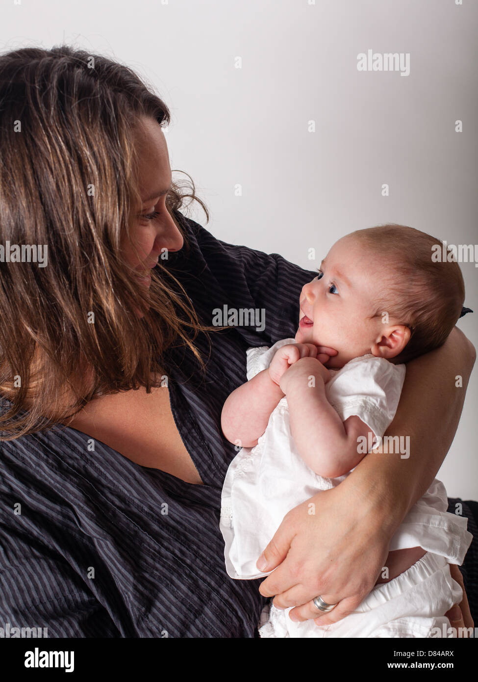 mother cuddle with happy baby Stock Photo - Alamy