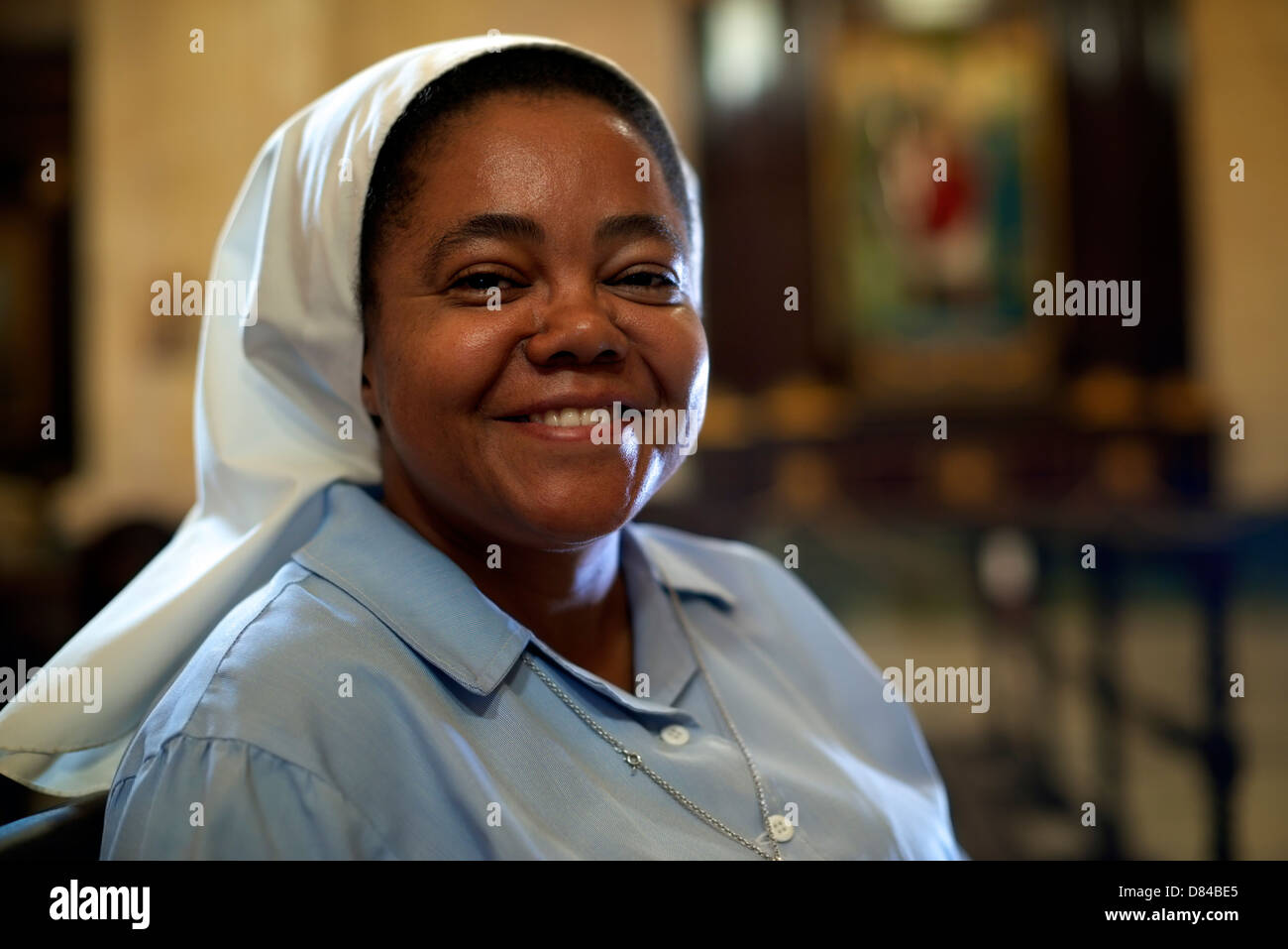 Woman and religion, portrait of catholic nun praying in church and ...