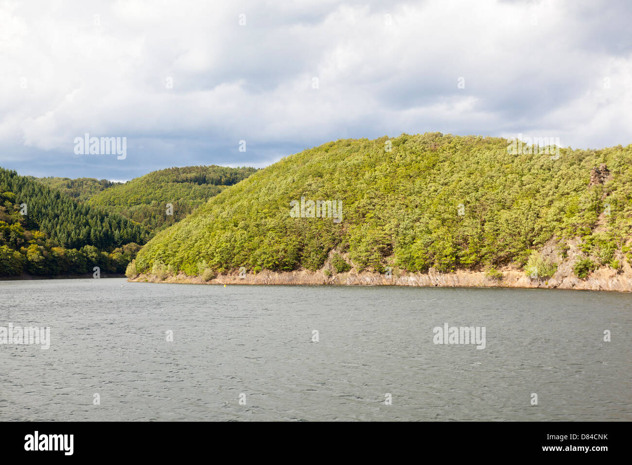Lake Rursee cliff lakeshore with cloudy sky and sunlight in summer ...