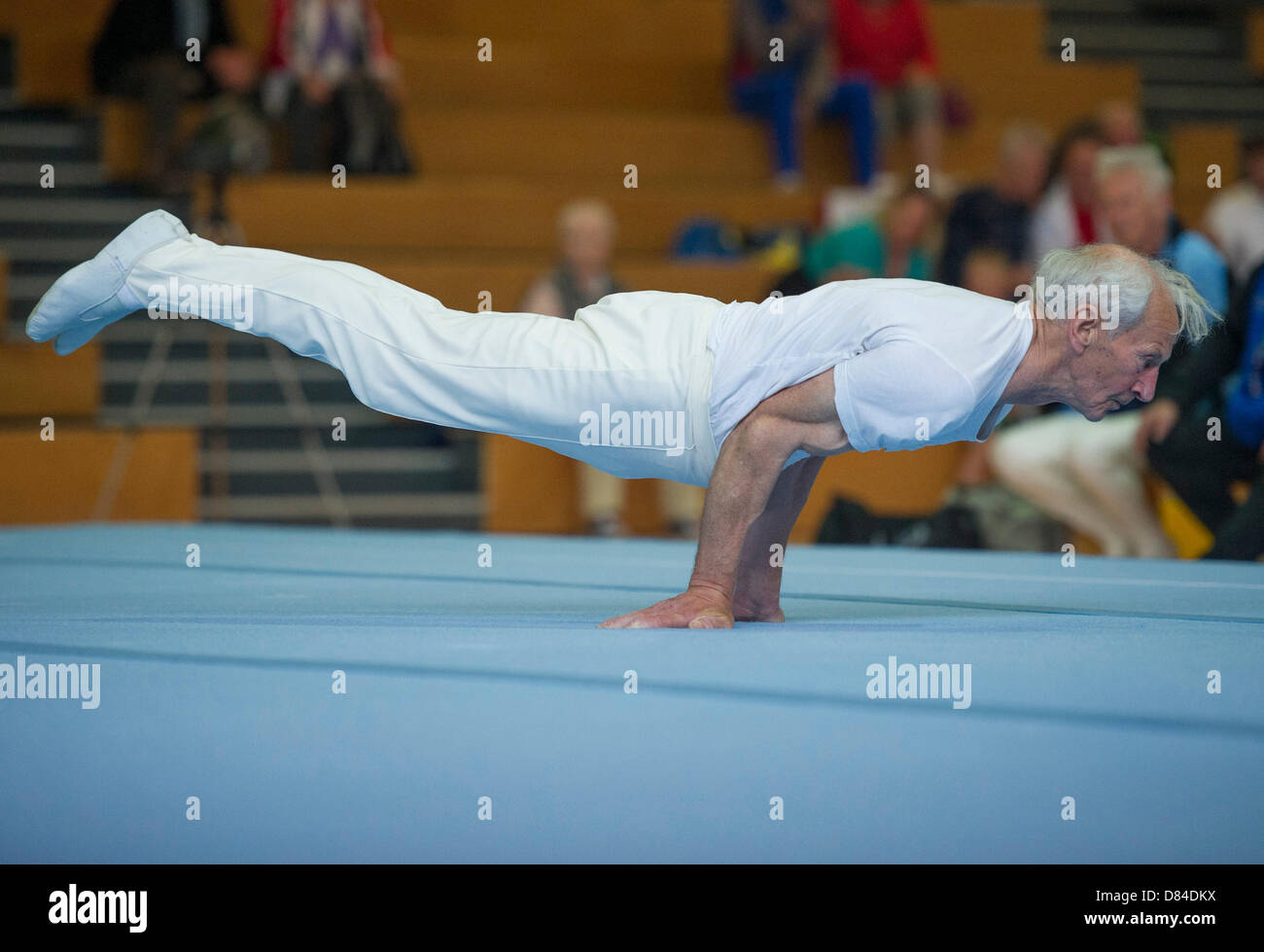 Participant of the German Gymnastics Festival performs an exercise ...