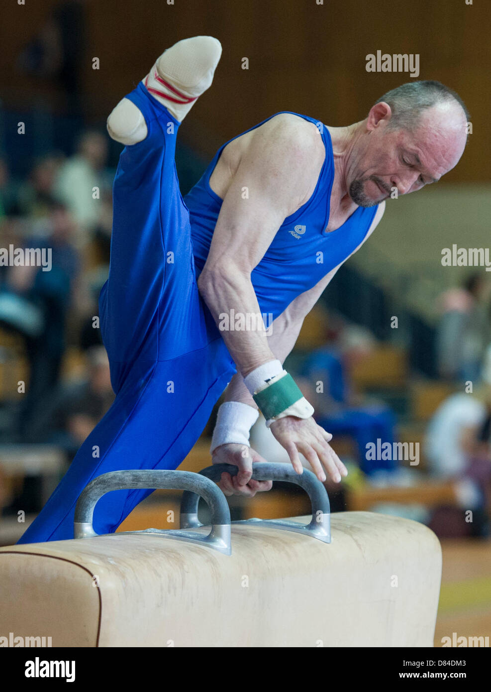 Participant of the German Gymnastics Festival performs an exercise ...