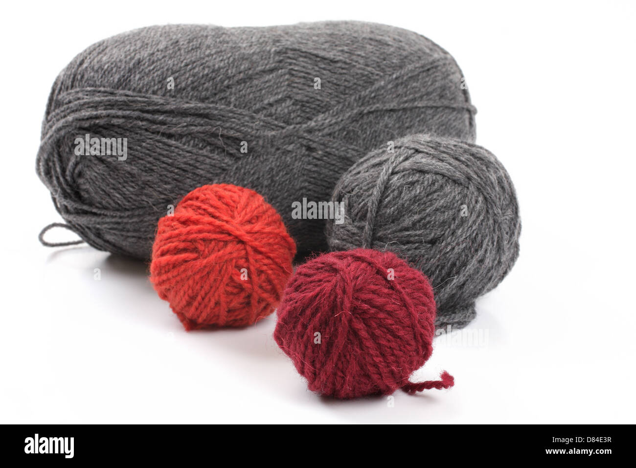 Several balls of wool on a white background Stock Photo - Alamy