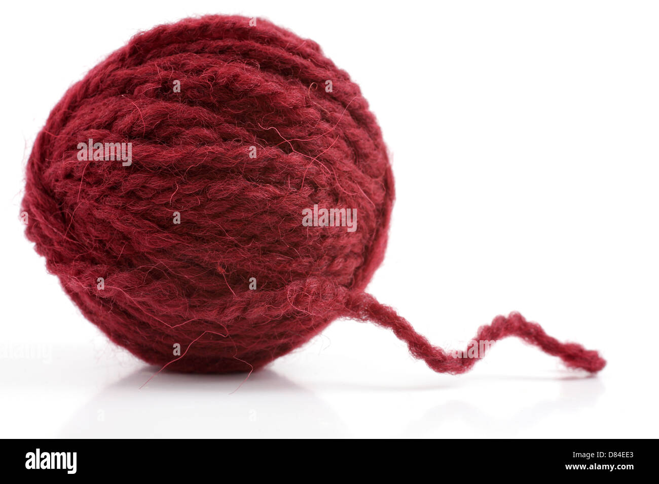 ball of woolen threads on a white background Stock Photo - Alamy