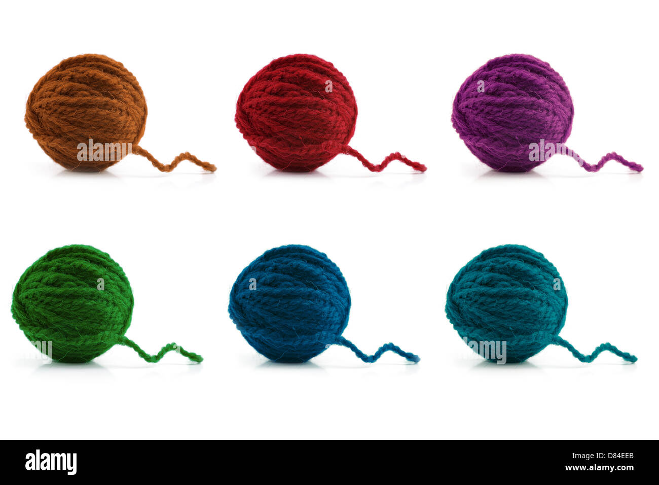 Multi-colored balls of wool on a white background Stock Photo - Alamy