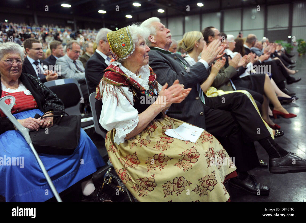 Woman in traditional costume of Sudeten Germans applauds during the ...