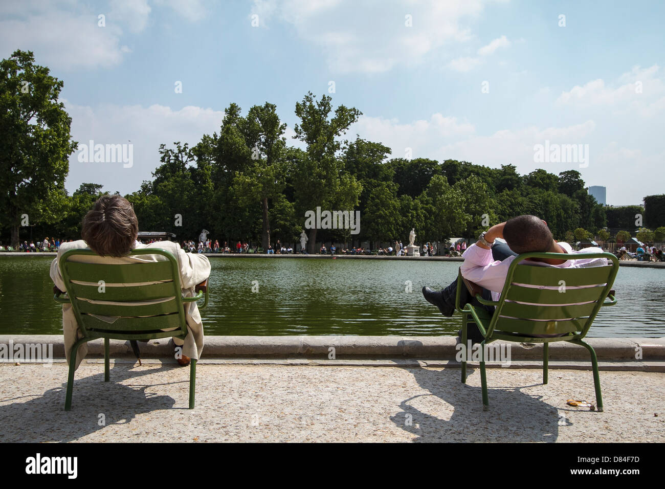 People having a break in the sun in Paris Stock Photo - Alamy