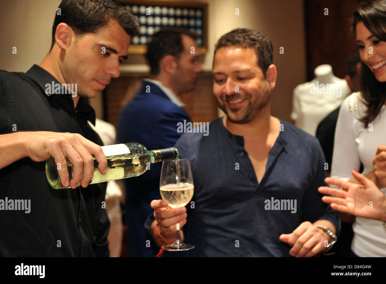 NEW YORK - MAY 16: Designer Alvin Valley (C) and guests at Alvin Valley ...