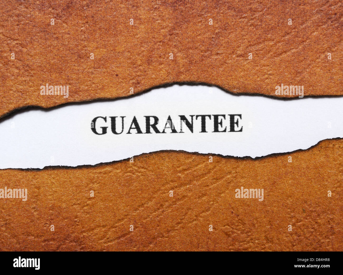 Guarantee text on paper hole Stock Photo - Alamy