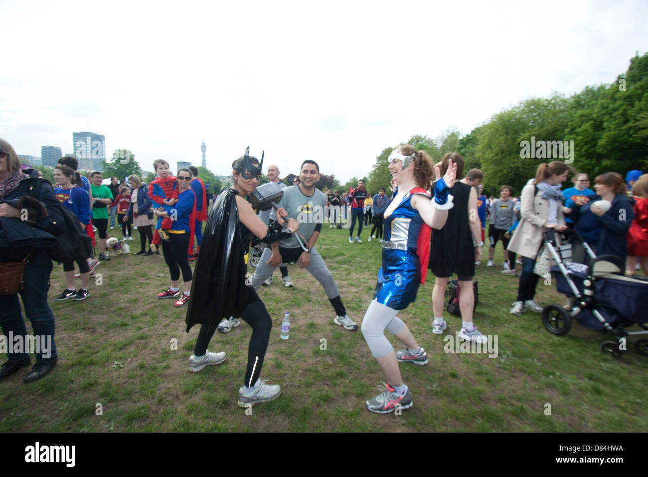 19th May 2013. London UK. Hundreds of people dressed as comic heroes ...