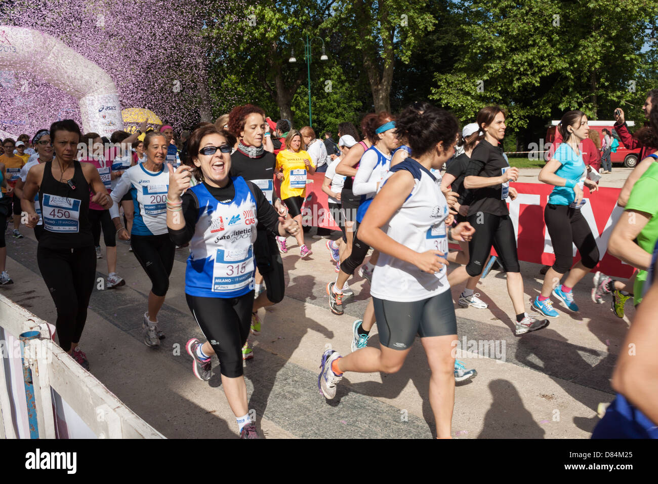 Milan, Italy - May 19, 2013: Thousands of women at the Avon running for ...