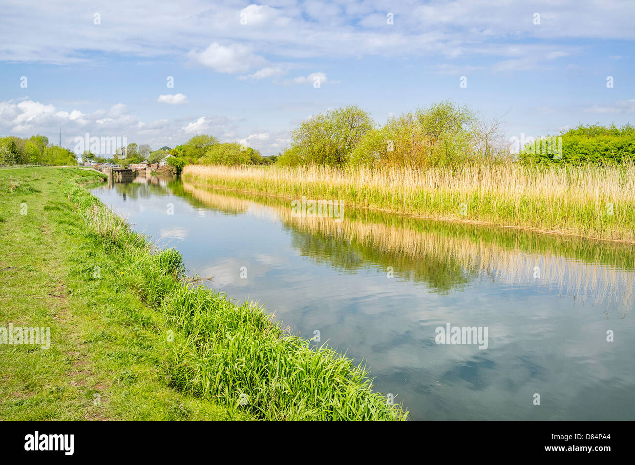 River Hull on a fine spring morning with blue sky and calm waters lined ...