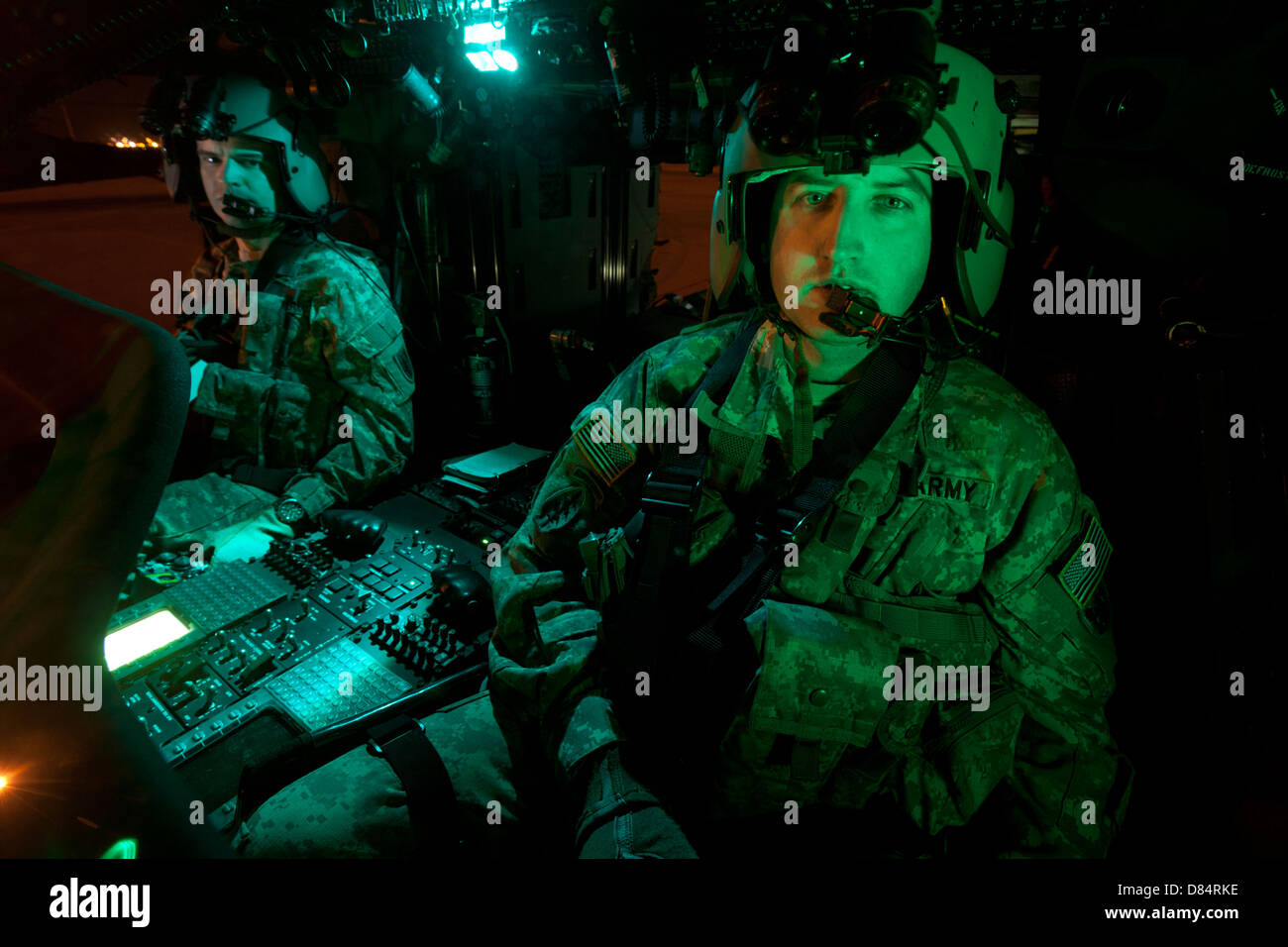 Pilots sitting in the cockpit of a UH-60 Black Hawk helicopter at Davis ...