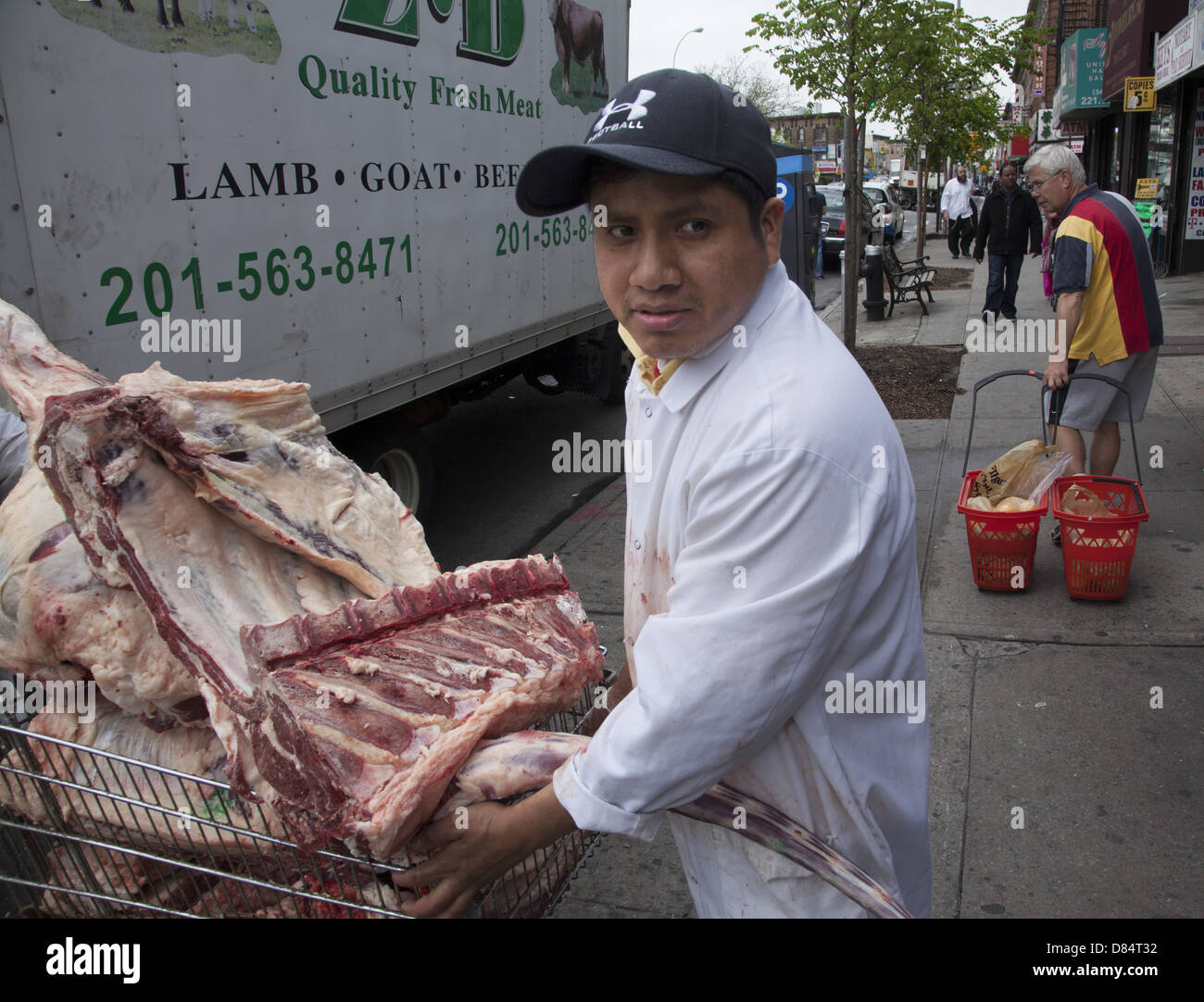 Man delivers fresh meat to a Halal meat store on Church Avenue in the ...