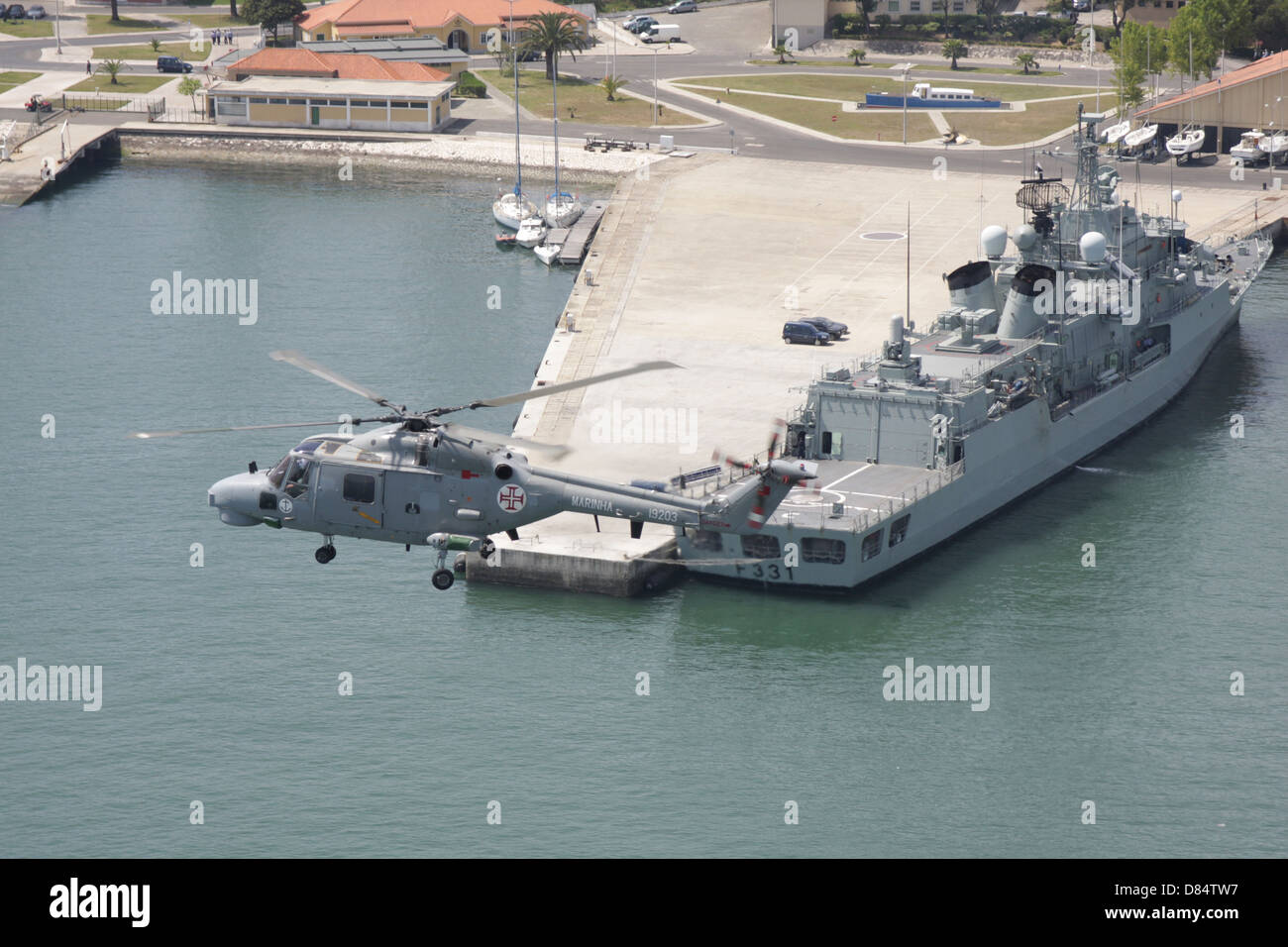A Portuguese Navy Lynx helicopter flying over the military harbor at ...