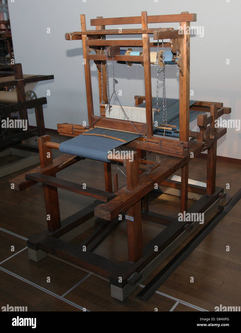 This late 19th-century Japanese hand loom features a flying shuttle, a ...