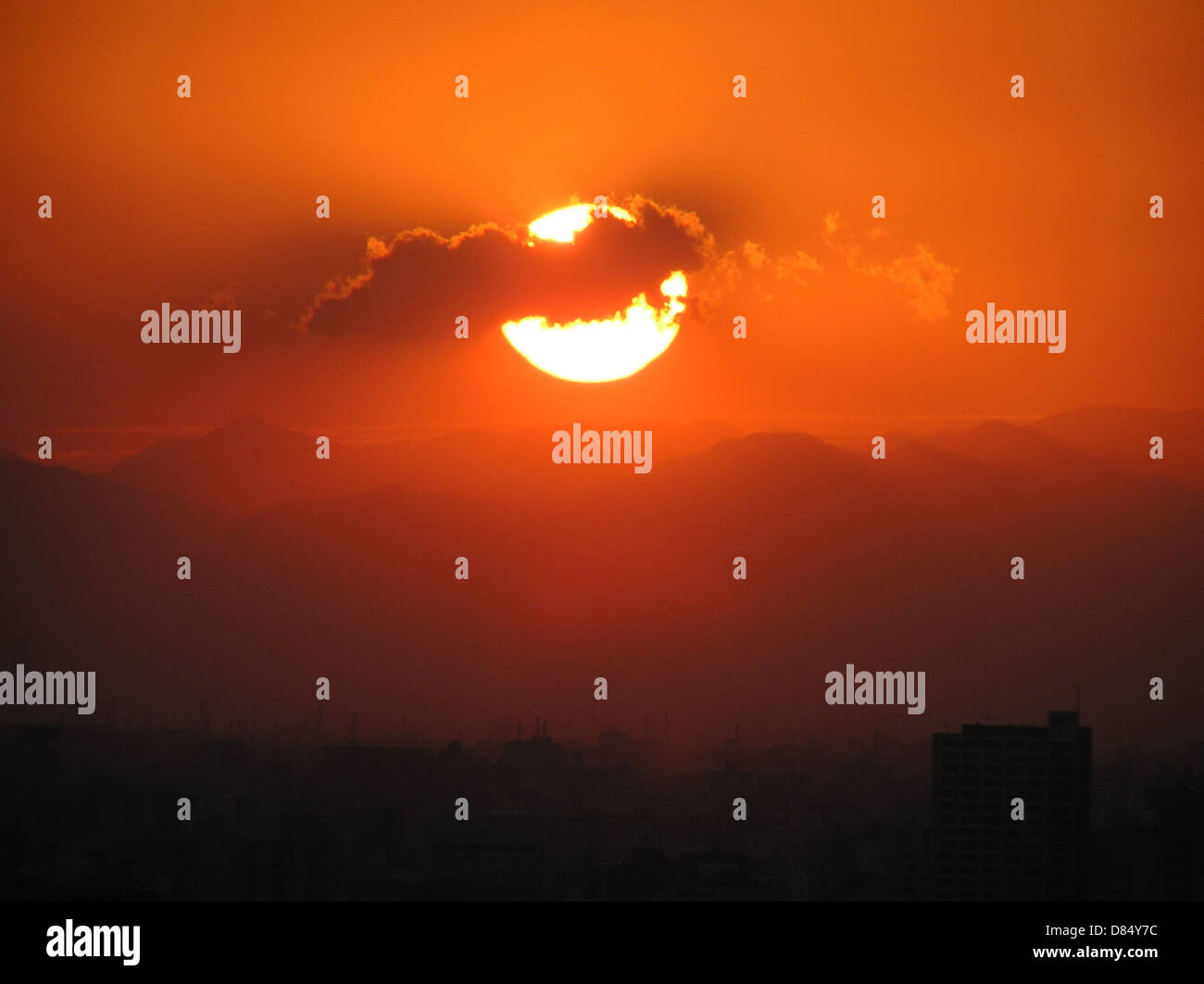 This photo captures the sunset in Tokyo, Japan, on October 2, 2003. The ...
