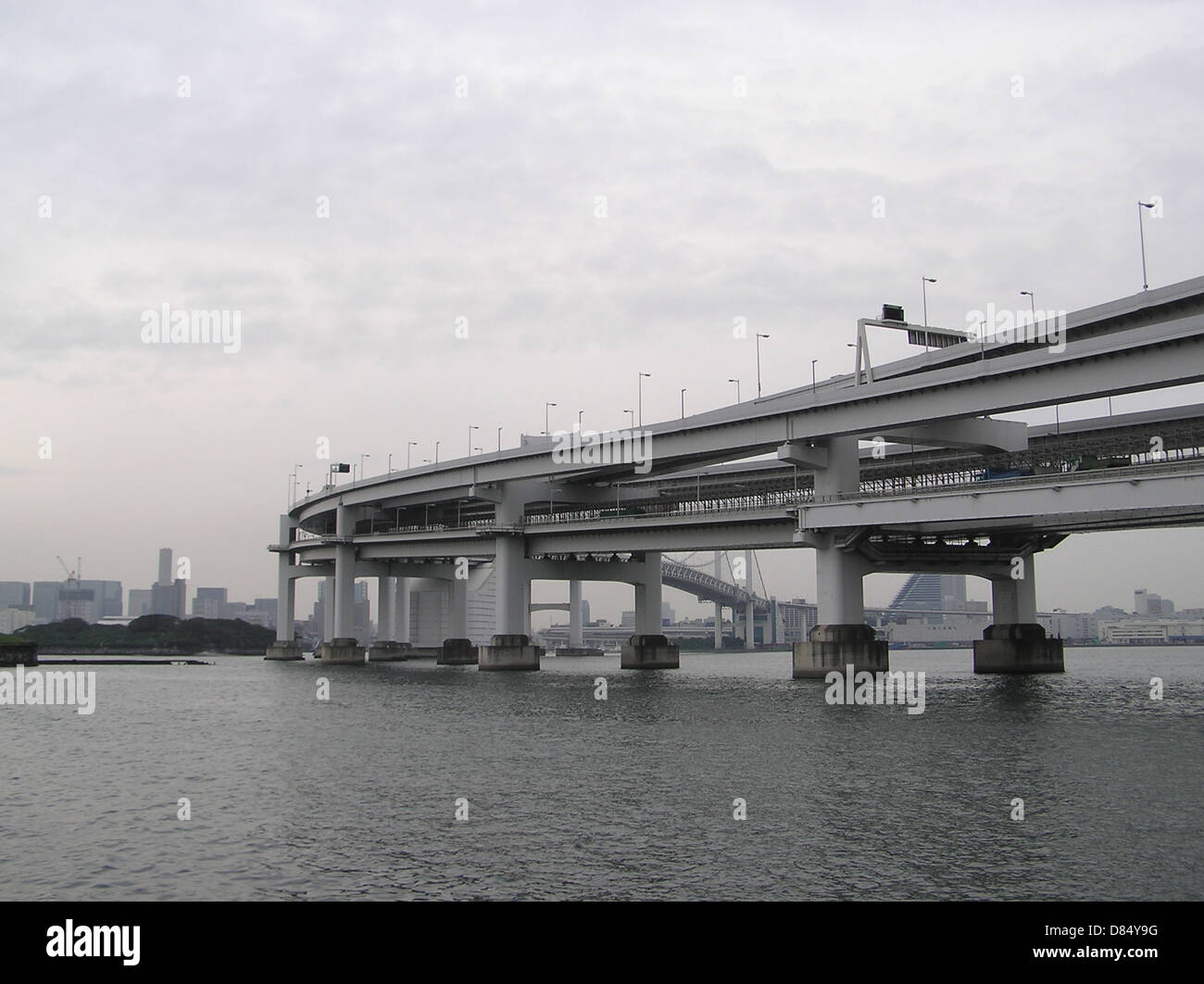 The Rainbow Bridge in Tokyo, Japan, connects the Shibaura district with ...