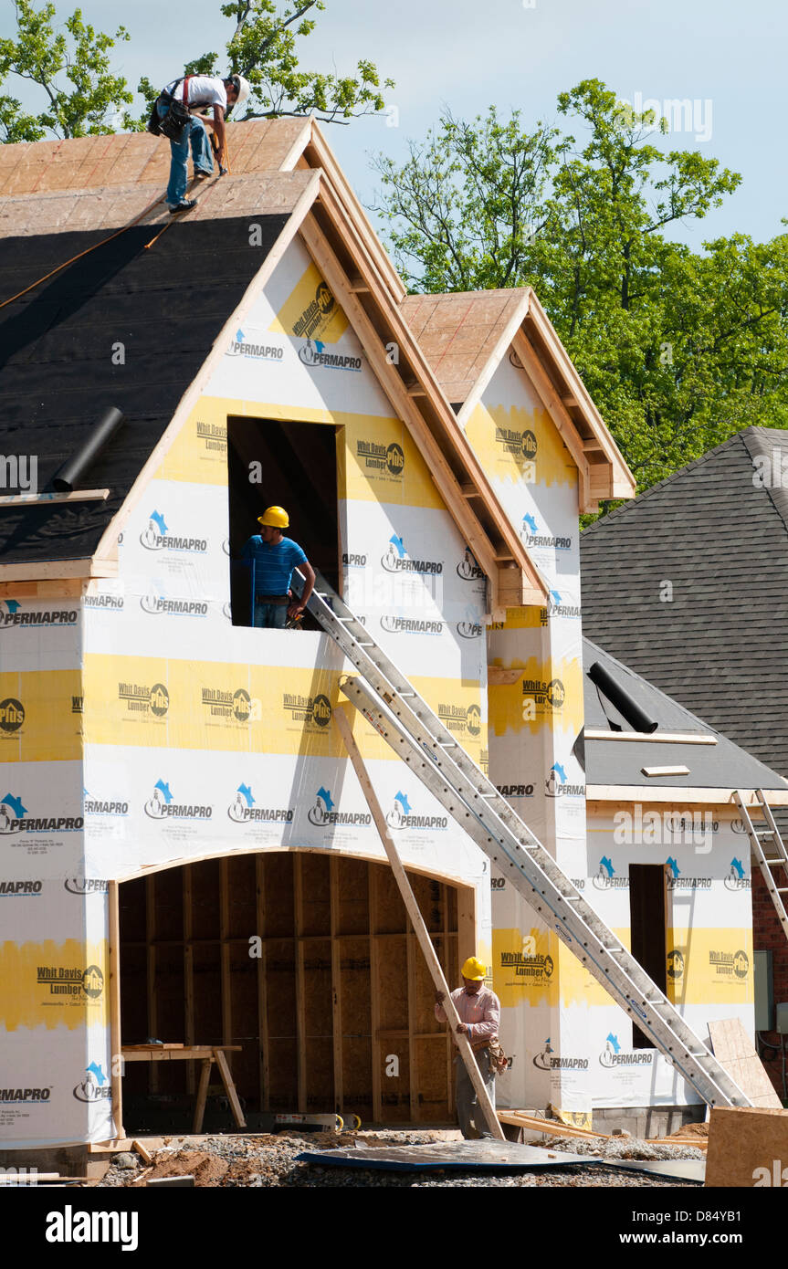 Construction workers on residential home construction site Stock Photo ...
