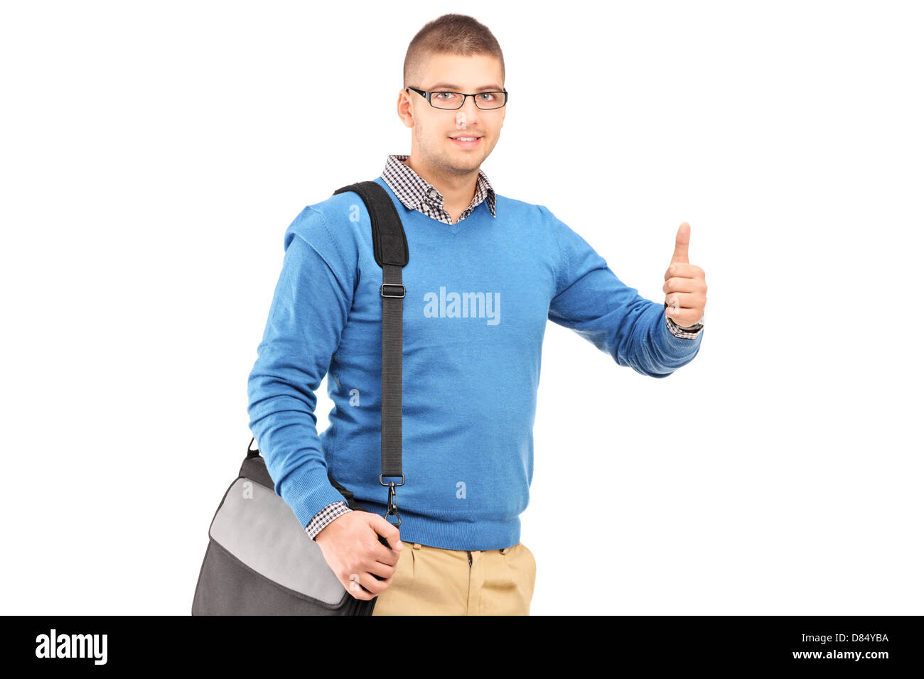 Young man with a shoulder bag giving a thumb up isolated on white ...