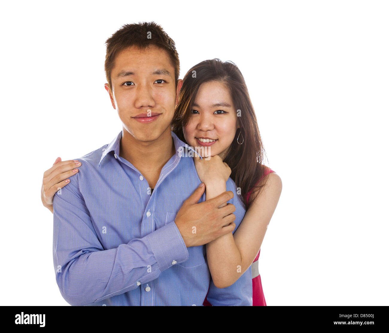 horizontal photo of a young adult couple holding each other while ...
