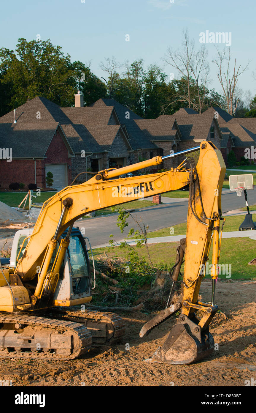 Backhoe on an empty lot for new residential home construction. Arkansas ...