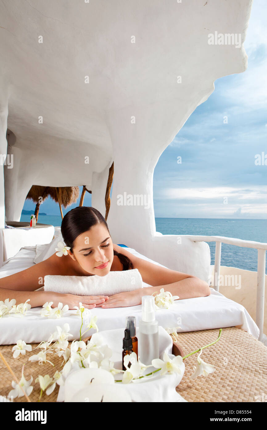 young woman lying on her front sptreatment Stock Photo - Alamy