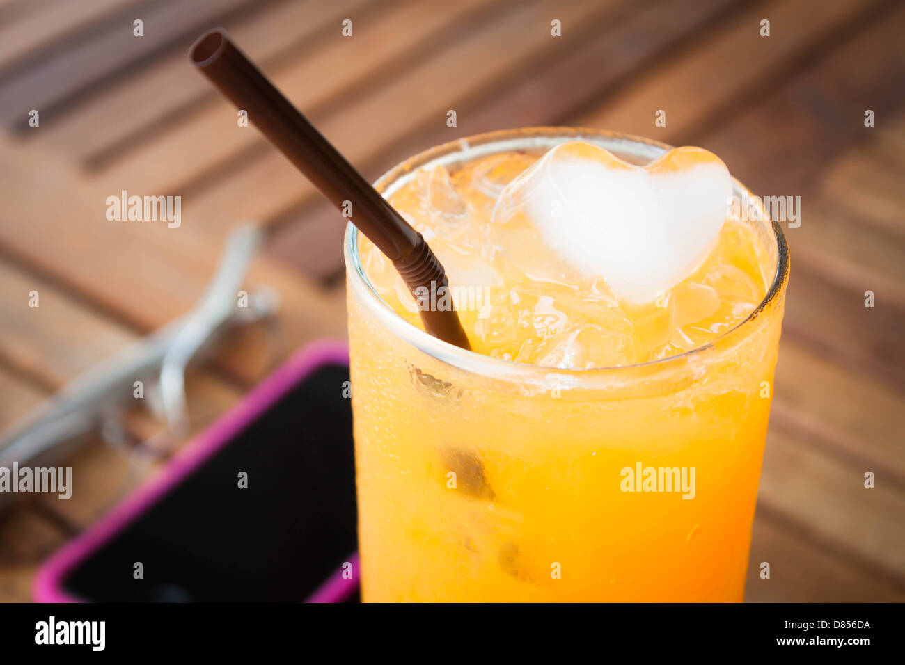 Break time with fresh iced orange juice Stock Photo - Alamy