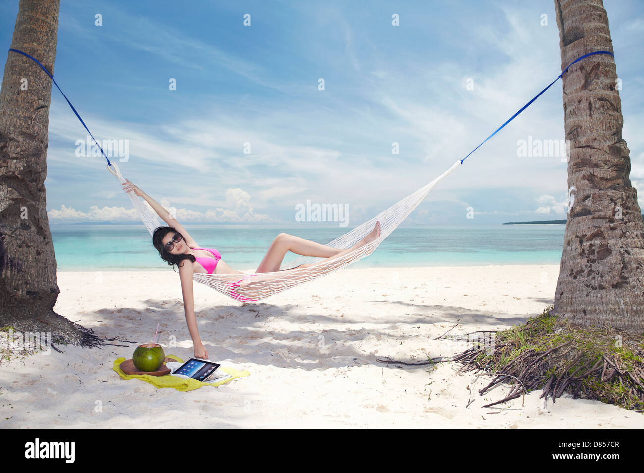 young woman relaxing in hammock beach Stock Photo - Alamy