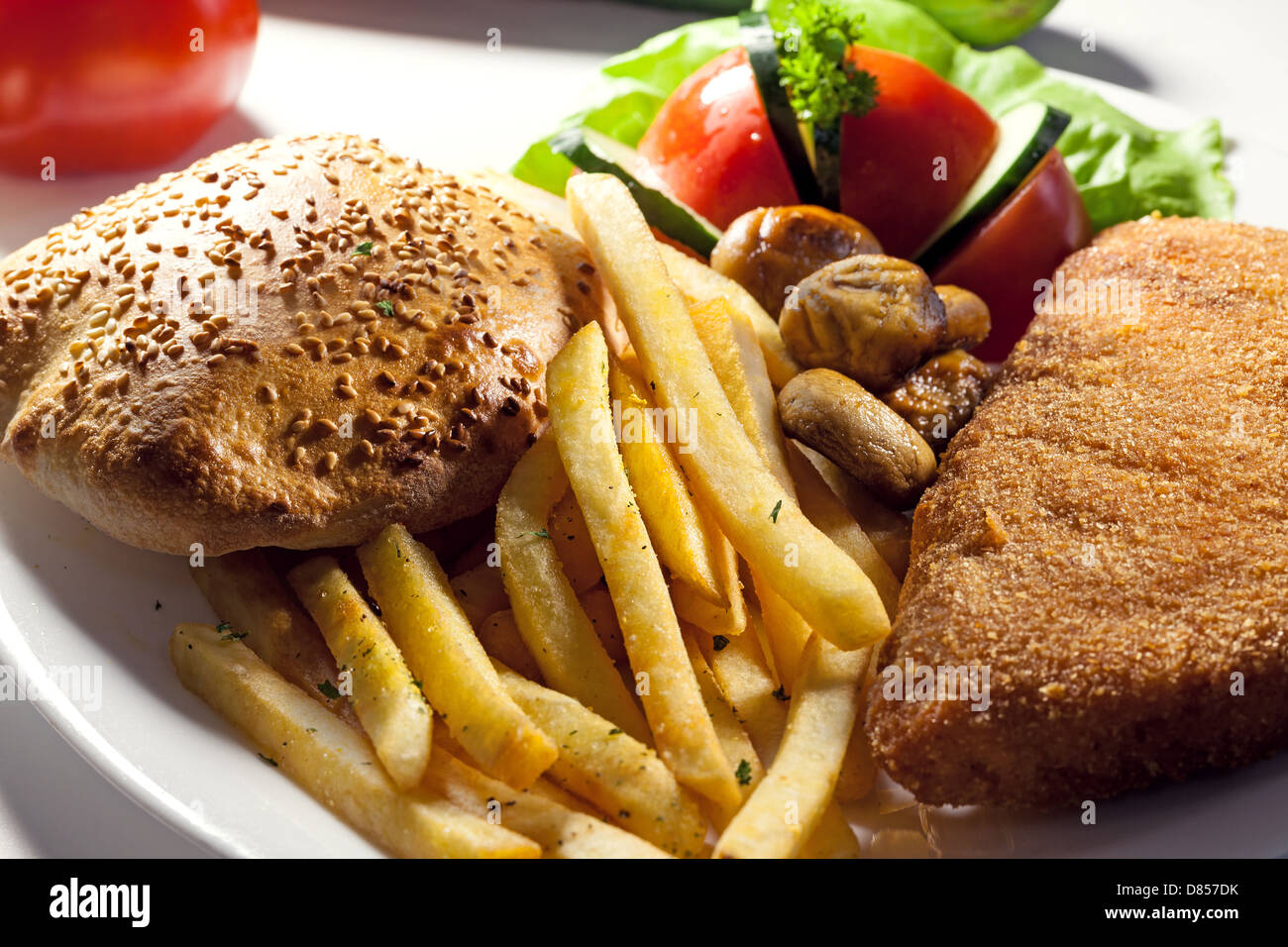 Portion for breakfast, meat, fries and bun Stock Photo - Alamy