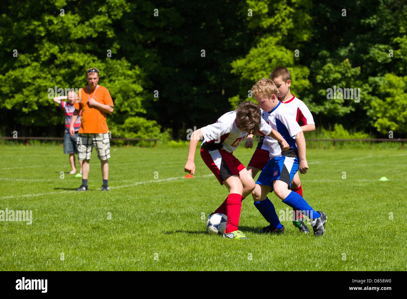 Little Boys playing soccer match Stock Photo - Alamy