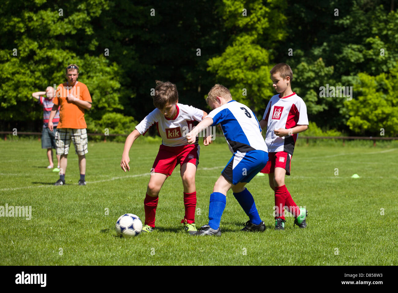 Little Boys playing soccer match Stock Photo - Alamy