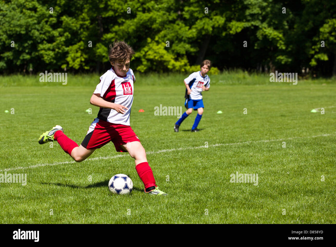 Little Boys playing soccer match Stock Photo - Alamy