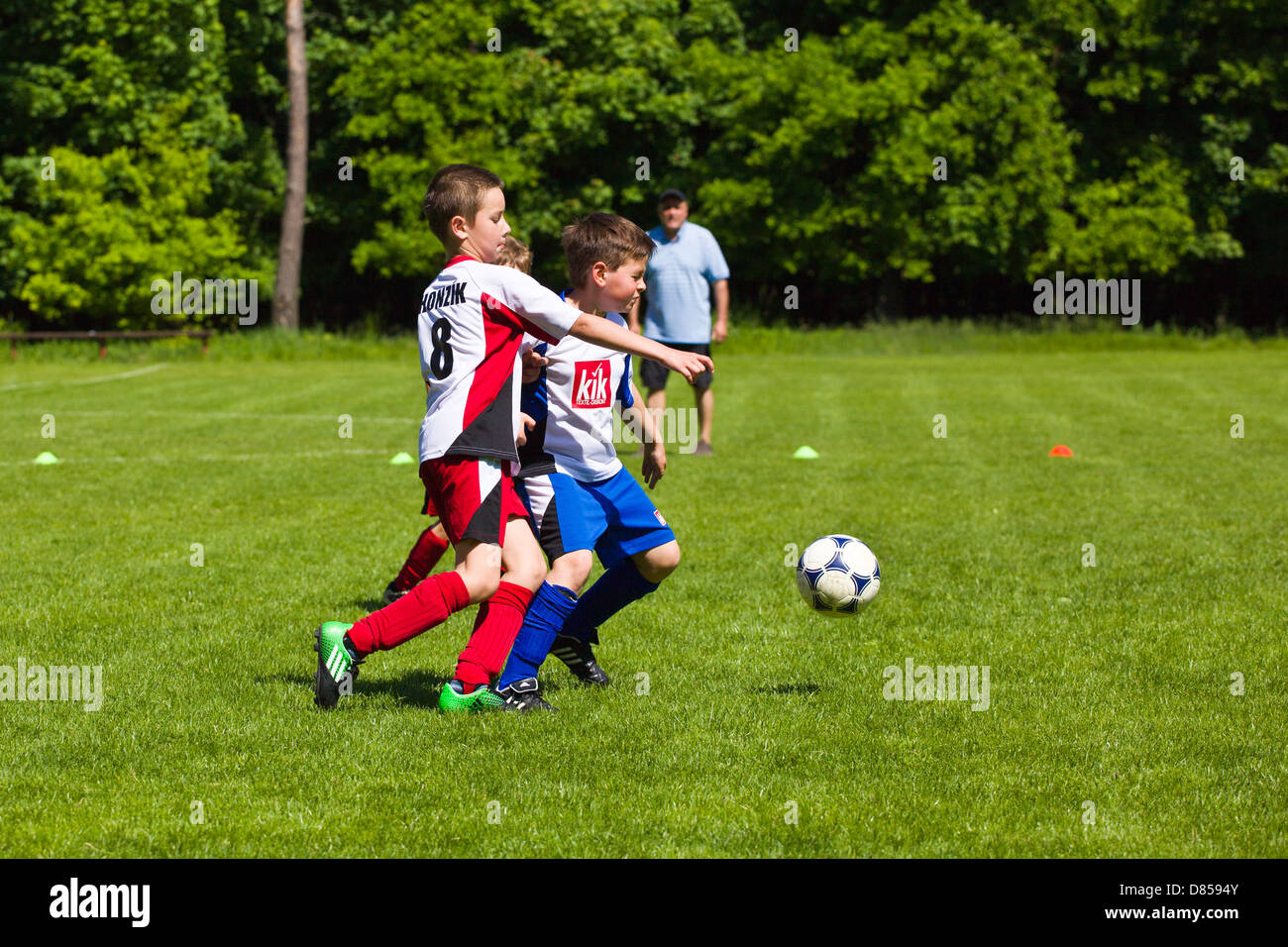 Little Boys playing soccer match Stock Photo - Alamy