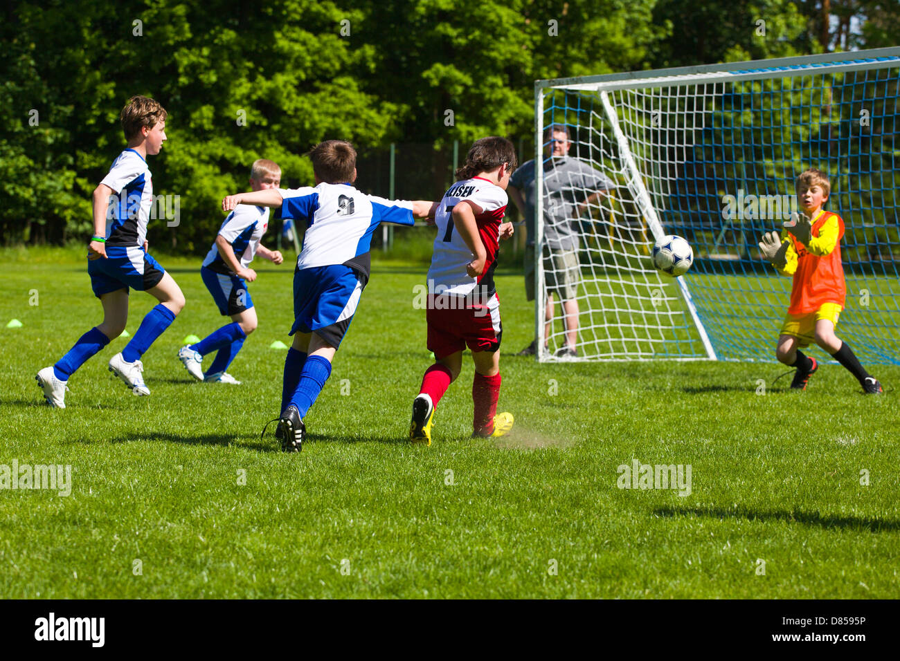 Little Boys playing soccer match Stock Photo - Alamy