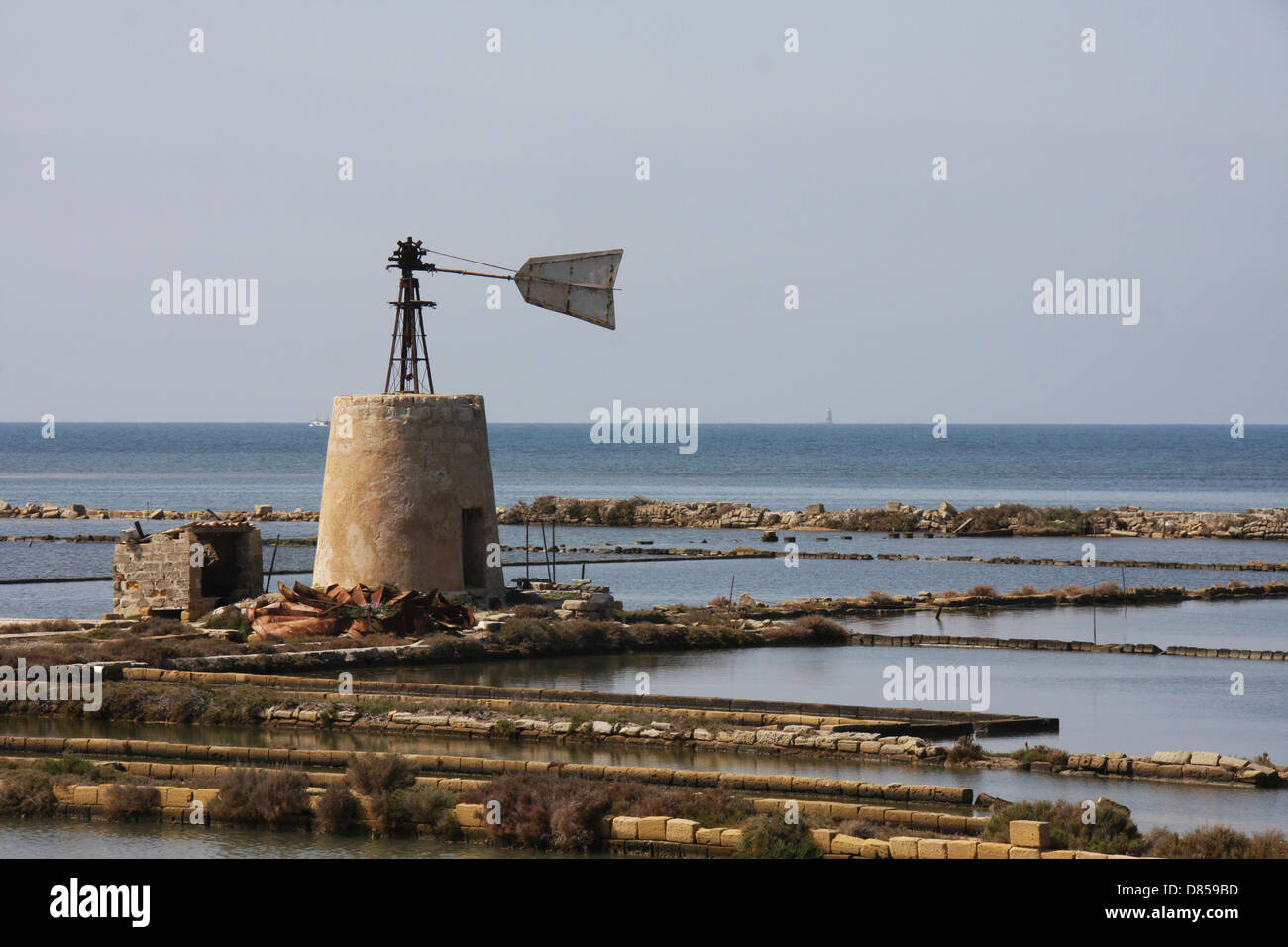 Windmill pump on salt pans Stock Photo - Alamy