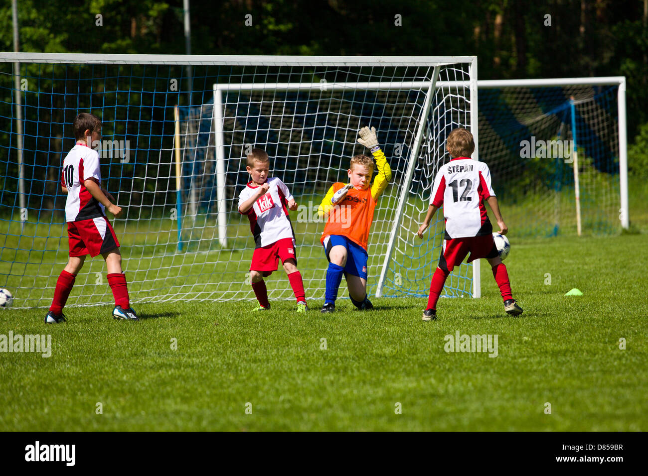 Little Boys playing soccer match Stock Photo - Alamy