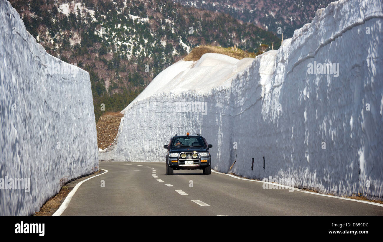 As winter fades and spring arrives, snow is cleared from the road ...