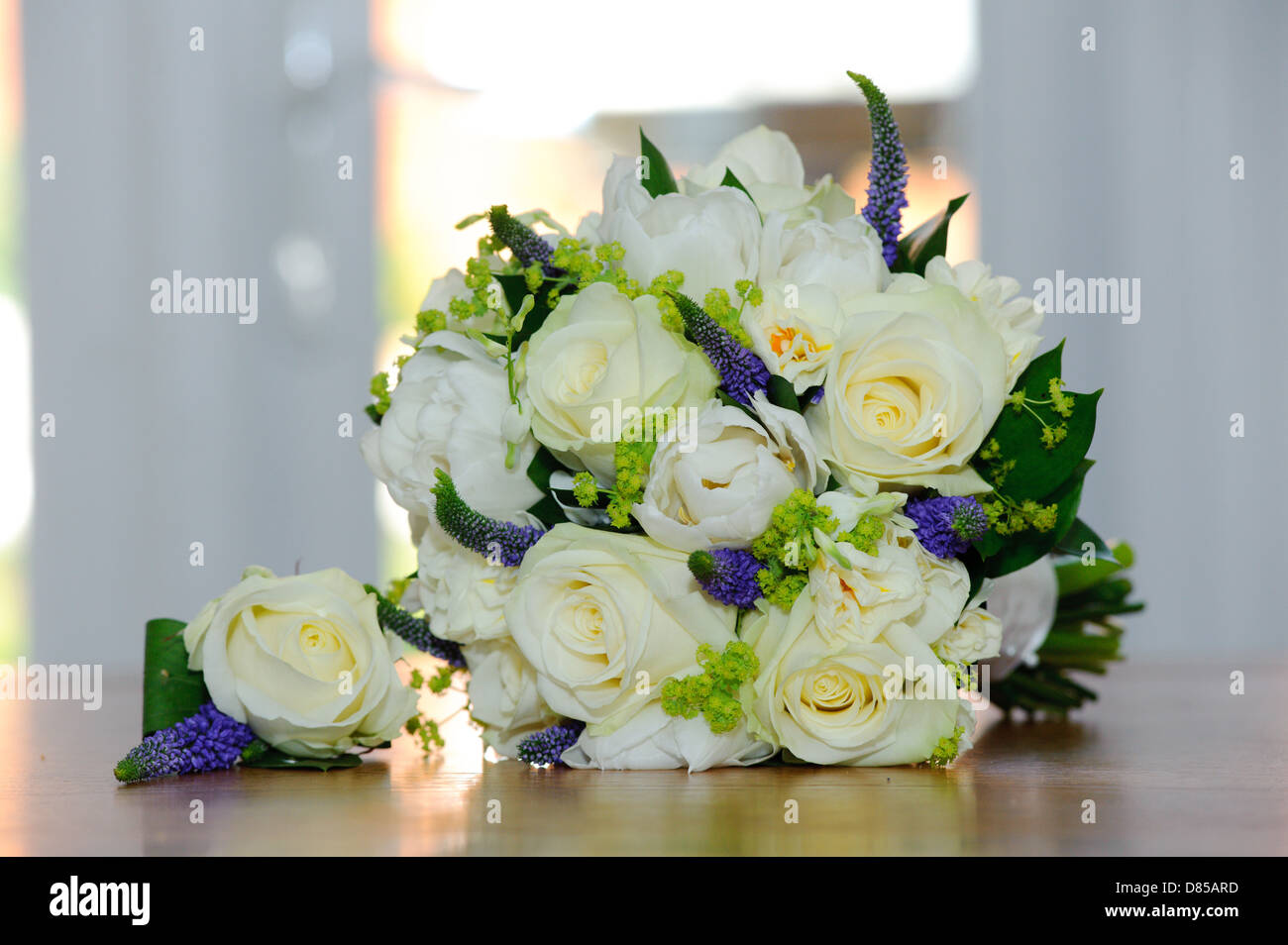 Wedding flowers on table for the bride and groom Stock Photo - Alamy