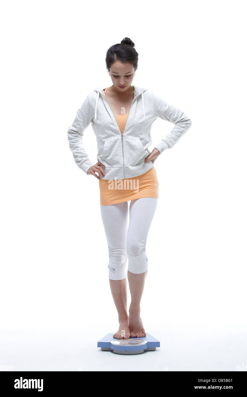 young woman posing on scales Stock Photo - Alamy