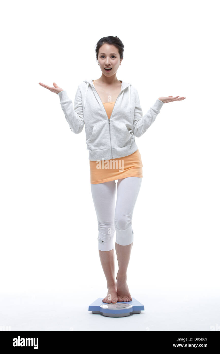 young woman posing on scales Stock Photo - Alamy