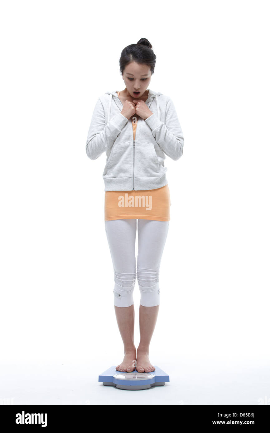 young woman posing on scales Stock Photo - Alamy